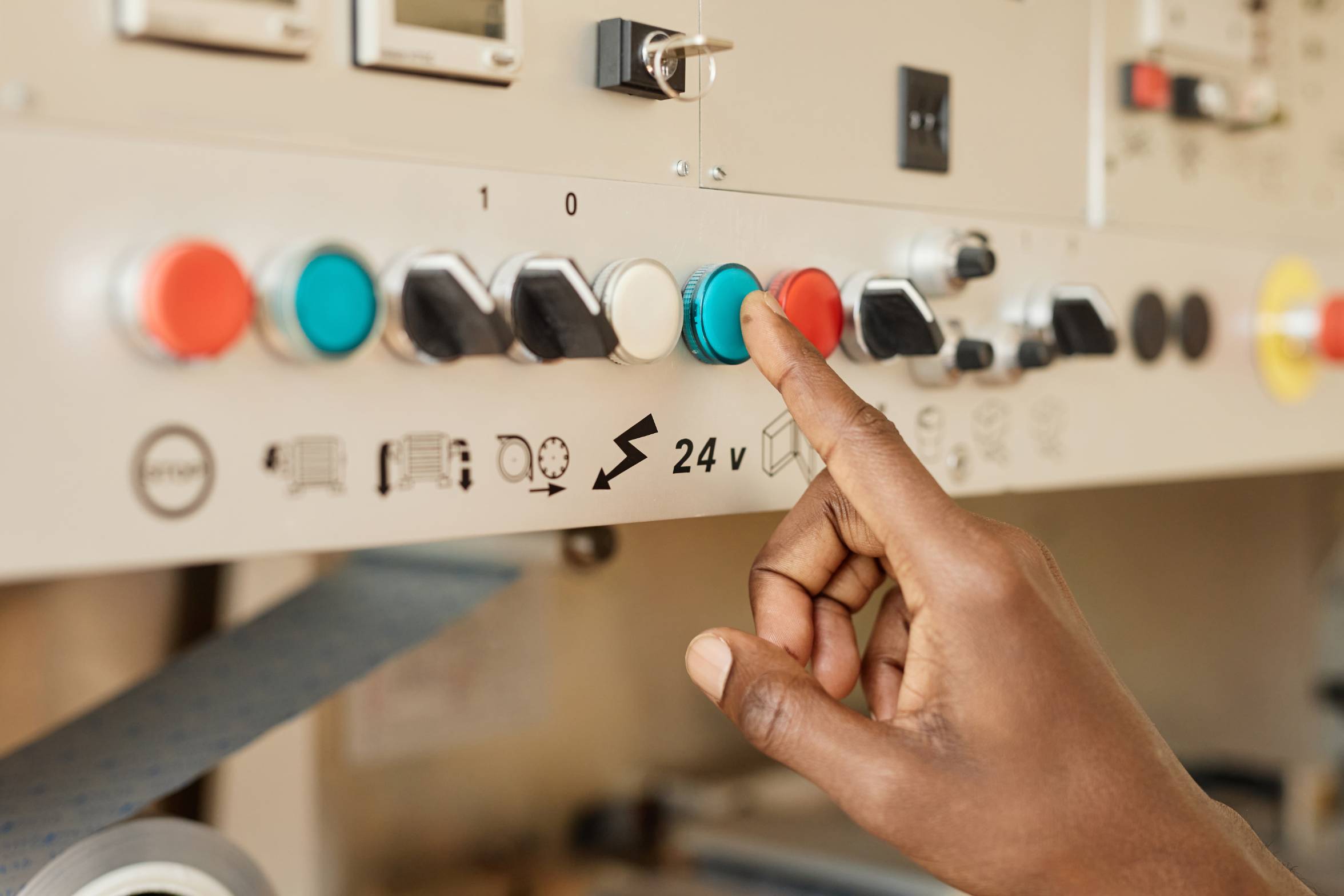black-young-man-using-control-panel-at-factory-foc-2023-11-27-04-58-20 ...